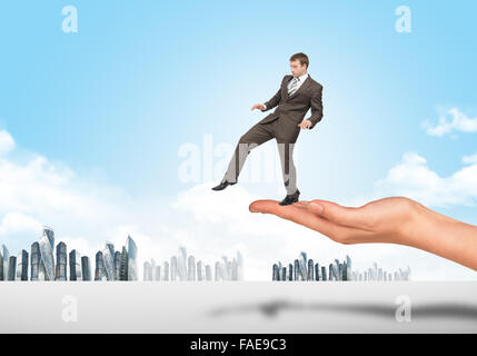 Businessman walking gingerly Stock Photo - Alamy