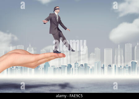 Businessman walking gingerly Stock Photo - Alamy