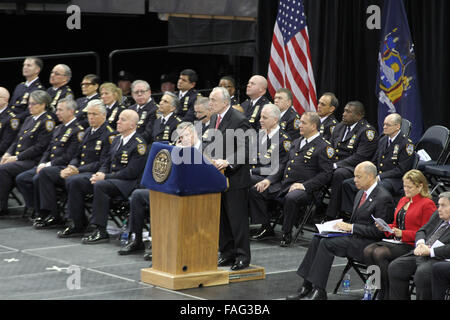 A New York City Police Academy graduate bows his head during a ...