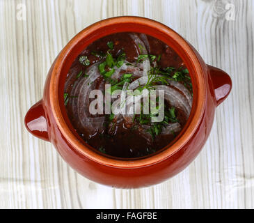 Georgian cuisine - Lobio with onion rings and fresh herbs Stock Photo ...