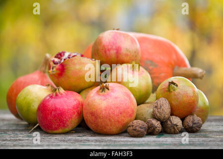 Delicious pomegranates on table outdoors Stock Photo - Alamy