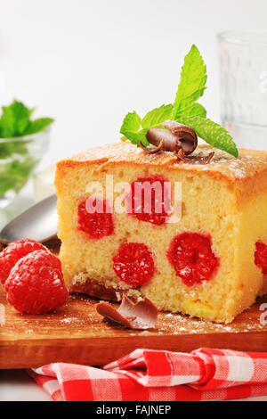 Closeup shot of a raspberry cake piece eon the white plate Stock Photo ...