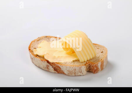 Slice of white bread with curl of butter, close up Stock Photo - Alamy