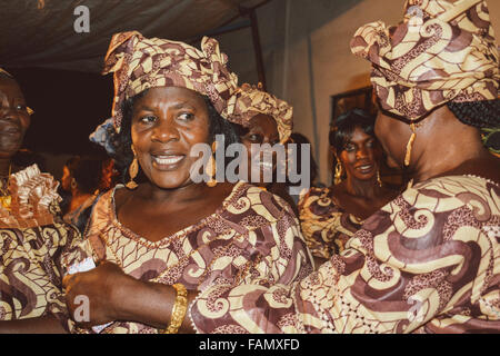Gambian ladies dancing and smiling. Women are wearing brown pattern ...