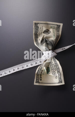 close up of the us currency and tape measure Stock Photo - Alamy