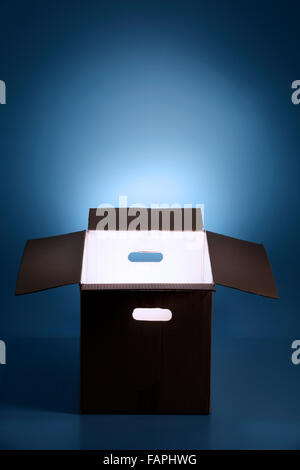 Glowing rays of light coming out of an open box Stock Photo - Alamy