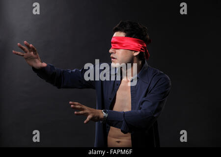 man with blindfolded with red cloth Stock Photo - Alamy