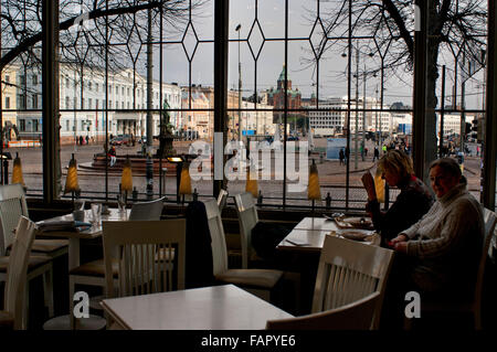 Inside Havis Amanda restaurant, Helsinki, Finland. A couple eating at ...