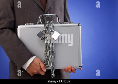 man holding the brief case with extra lock Stock Photo - Alamy