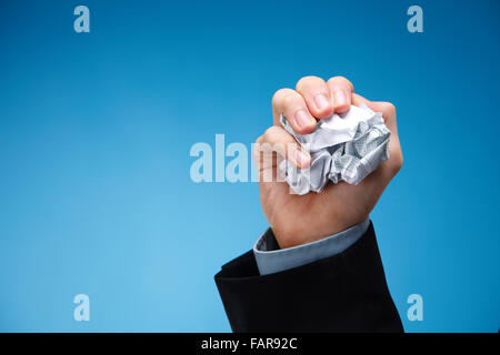 Human hand holding a scrunched up paper Stock Photo - Alamy