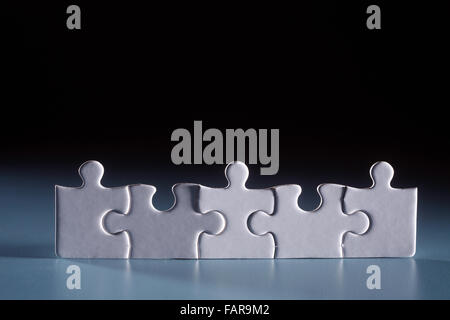 Five puzzle pieces arranged together Stock Photo - Alamy