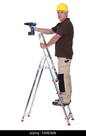 portrait of tradesman using a screwdriver Stock Photo - Alamy