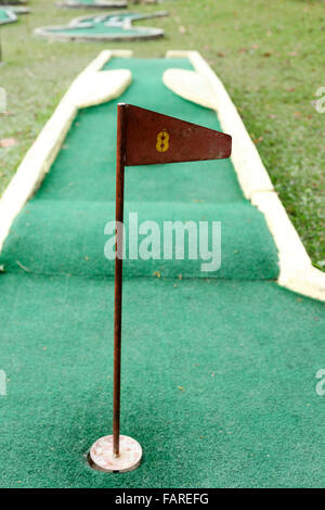 number eight flag on a mini golf course Stock Photo - Alamy