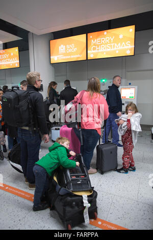 Christmas holiday makers check in at the easyJet bag drop facilities ...