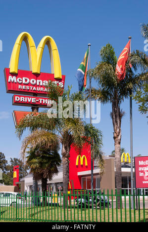 JOHANNESBURG, SOUTH AFRICA -McDonald's Restaurant billboard and man ...