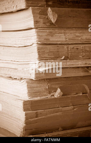 stack of old books with pages torn out isolated on white background ...