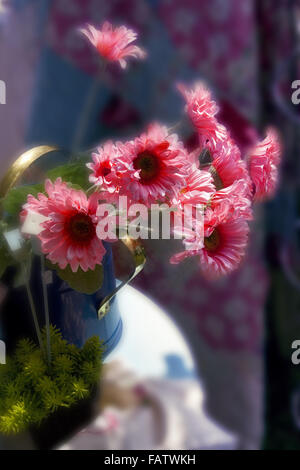 Bouquet of blooming pink flowers placed in the bottom of white ...