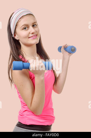 portrait of pretty sporty girl holding weight Stock Photo - Alamy