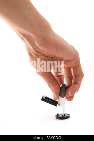 Plastic stamp in hand, isolated Stock Photo - Alamy