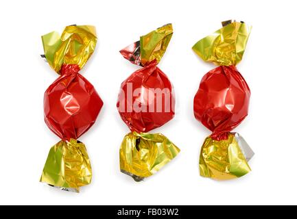 2 sweets wrapped in red and gold wrappers Stock Photo - Alamy