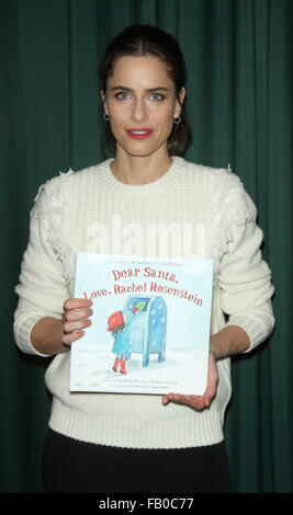 Author Andrea Troyer and actress Amanda Peet sign copies of their book ...
