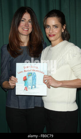 Author Andrea Troyer and actress Amanda Peet sign copies of their book ...