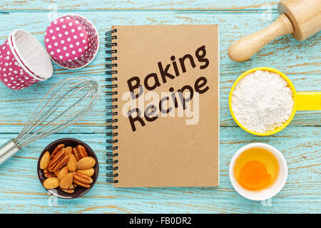 Note book and ingredients for baking on a wooden background Stock Photo ...