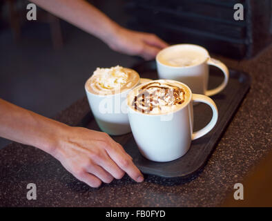 Closeup of a waiter delivering a cup of coffee to the bar counter Stock ...