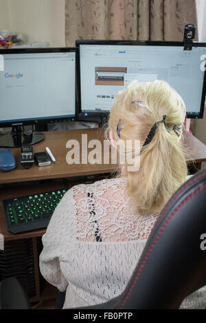 An Elderly lady at home online shopping Stock Photo - Alamy