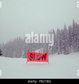 "Slow skiing" warning sign on ski slope in ski resort with majestic ...