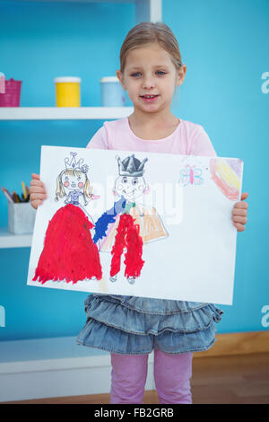 Cute girl showing her drawing Stock Photo - Alamy