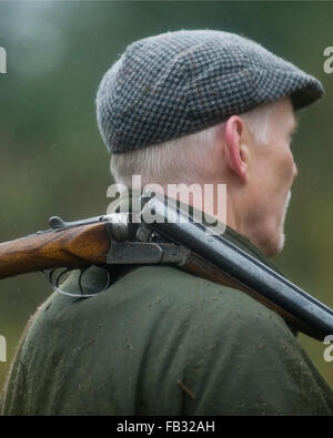 Man carrying a gun over his shoulder, Semien Mountains National Park ...