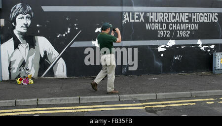 Irish Snooker star Higgins dies. Residents of Sandy Row walk past a ...