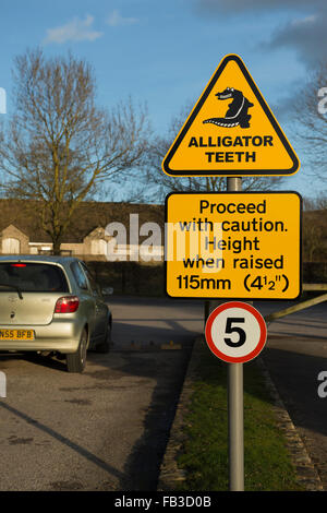 Alligator teeth warning road sign at an entrance to a city car park ...
