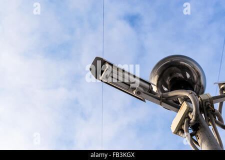 Two CCTV Cameras pointing in opposite directions with a bulb style ...