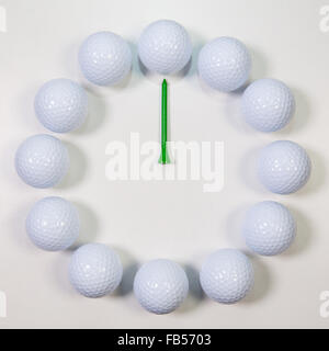 Golf Time - The clock of golf balls and wooden tees Stock Photo - Alamy