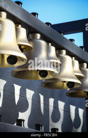 Color image of some various sized bells in a row Stock Photo - Alamy