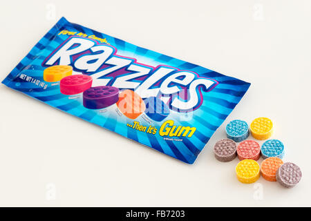 A packet of Razzles, a candy that once chewed, mixes to transform into ...