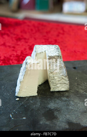 French pyramid shaped goat’s cheese and citrus fruit Stock Photo - Alamy