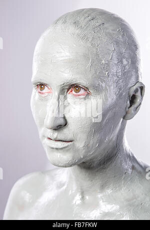 Women face in mud. Scary woman in mud. Spa treatment Stock Photo - Alamy