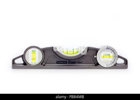 Spirit level tool or bubble levels at construction site. Laying ceramic ...