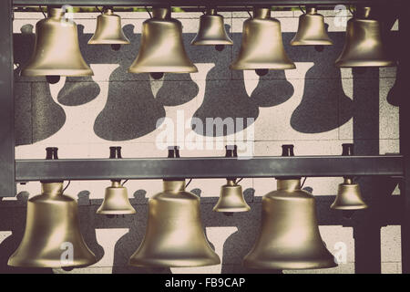 Various bells in a row Stock Photo - Alamy