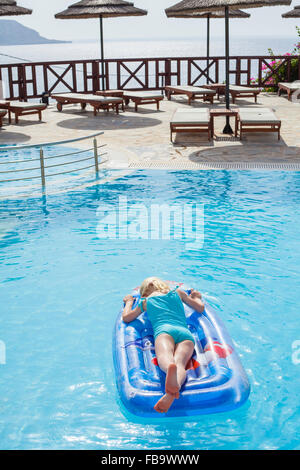 Girl lying on raft Stock Photo: 9499439 - Alamy