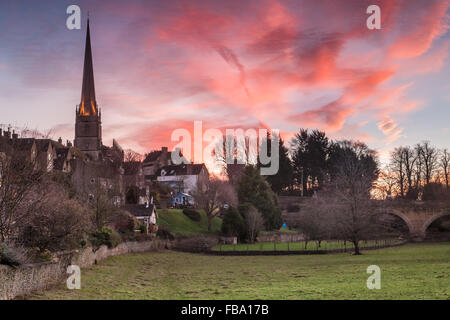 Red salmon sky dawn over Fawsley lake near Daventry Northamptonshire ...