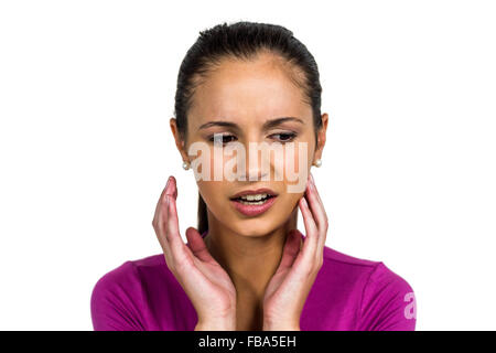 Sad casual woman standing isolated on a white background Stock Photo ...