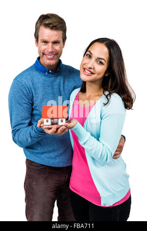 Young couple holding house model and key, closeup Stock Photo - Alamy