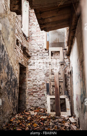 Interior of an abandoned decaying industrial building Stock Photo - Alamy