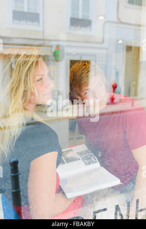 Outside looking through open window into office space Stock Photo - Alamy