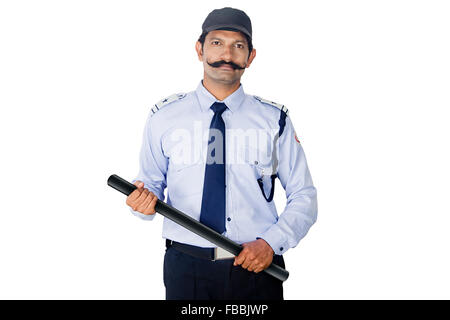 Portrait of Security guard standing with stick in his hand Stock Photo ...