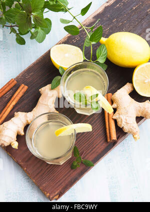 Fresh ginger with lemon on white background Stock Photo - Alamy